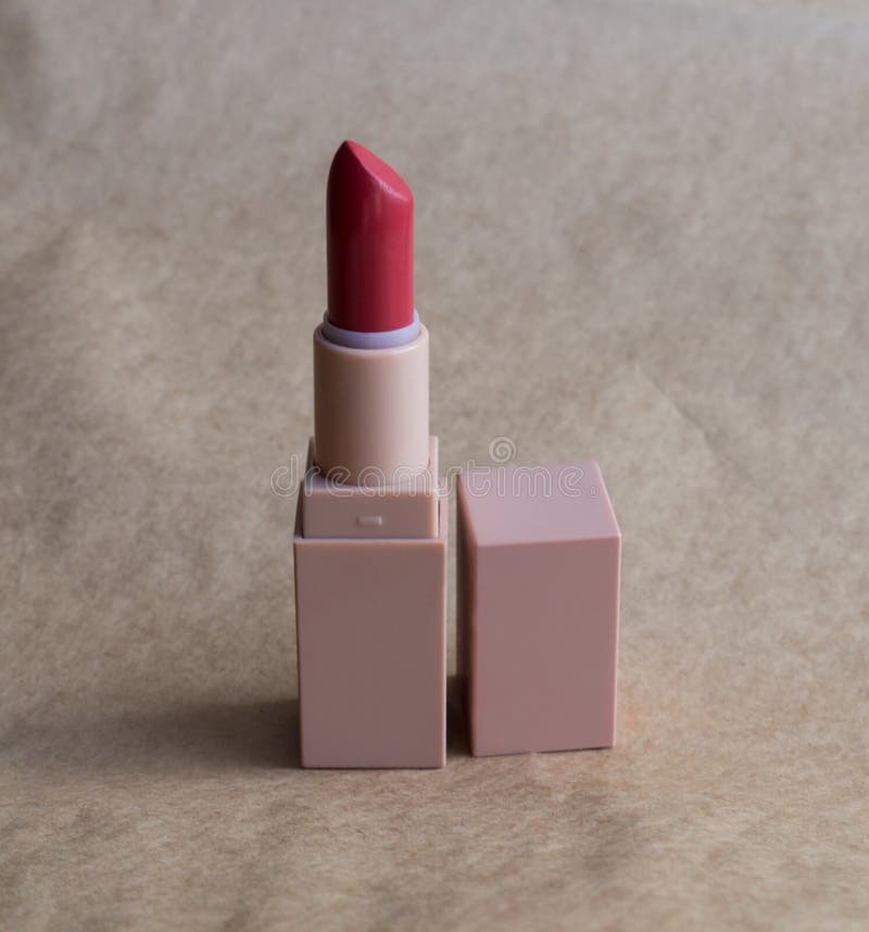 Red Lipstick in a Neutral Color Case Stock Photo - Image of fashion ...