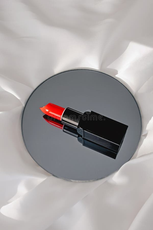 Red Lipstick on a Round Mirror with Reflection. Stock Photo - Image of ...