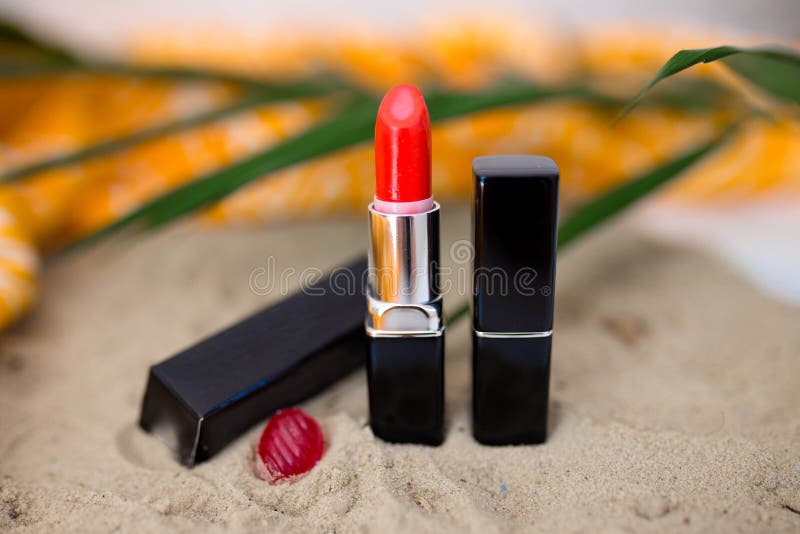 Red lipstick on sand stock image. Image of pout, shop - 172917675