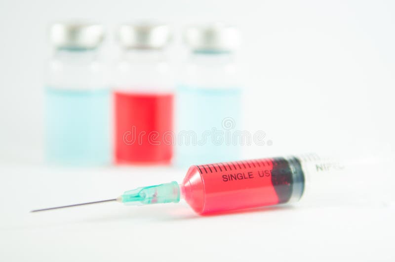 Red Liquid in Injection Syringe and Vials Background Stock Image ...