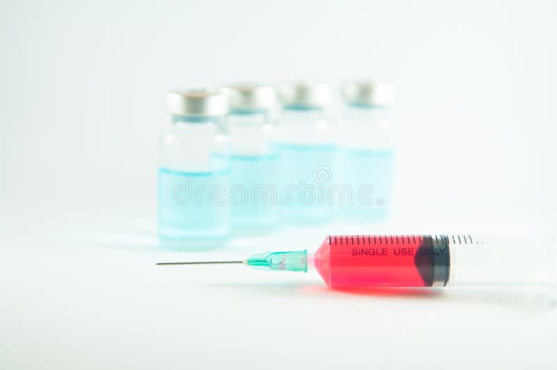 Red Liquid in Injection Syringe and Vials Background Stock Image ...