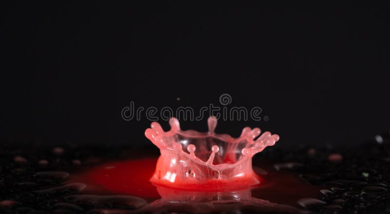 Red Liquid Ink Splash on Black Background Stock Photo - Image of ...