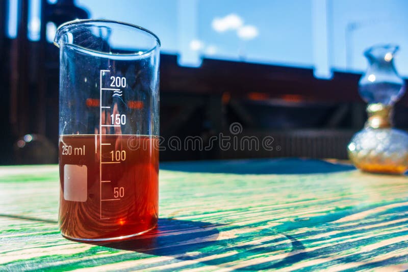 Red Liquid in a Measuring Transparent Glass Stands on the Table Stock ...