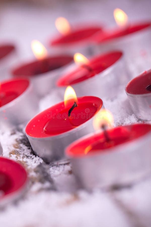 Red Lit Tealights with Golden Flame Stock Photo - Image of religious ...
