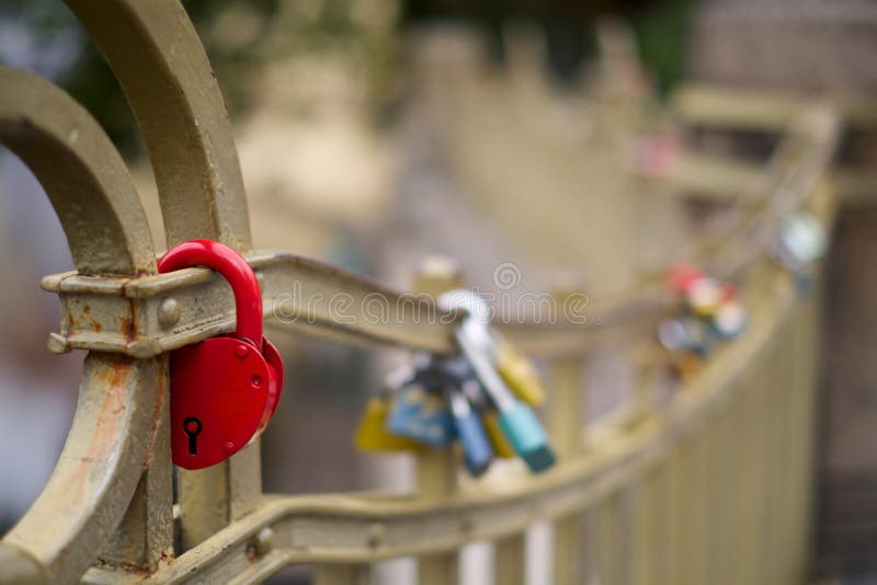 Red lock on a bridge stock image. Image of keyhole, heap - 36015101