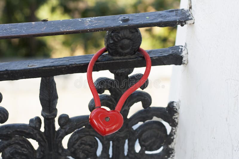 Red Locks in Heart Shape Wedding Bridge Photo. Love Concept. Stock ...