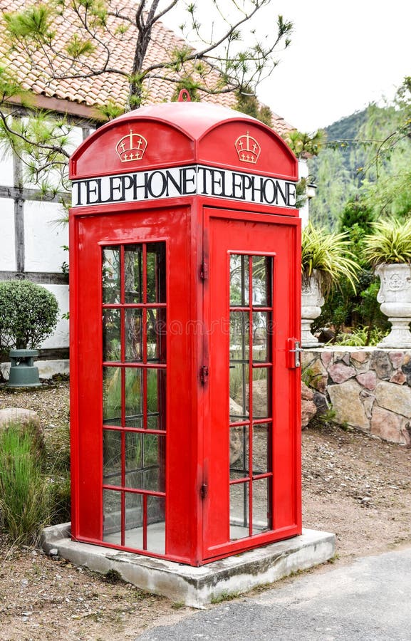 Red London Phone Booth in a Garden Editorial Image - Image of british ...