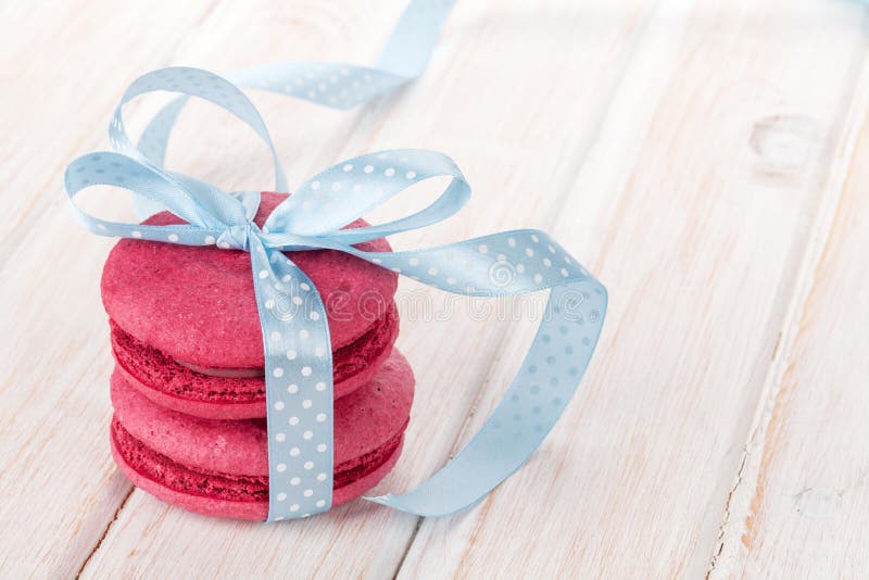 Red Macarons with Blue Ribbon Stock Photo - Image of dessert, macaroon ...