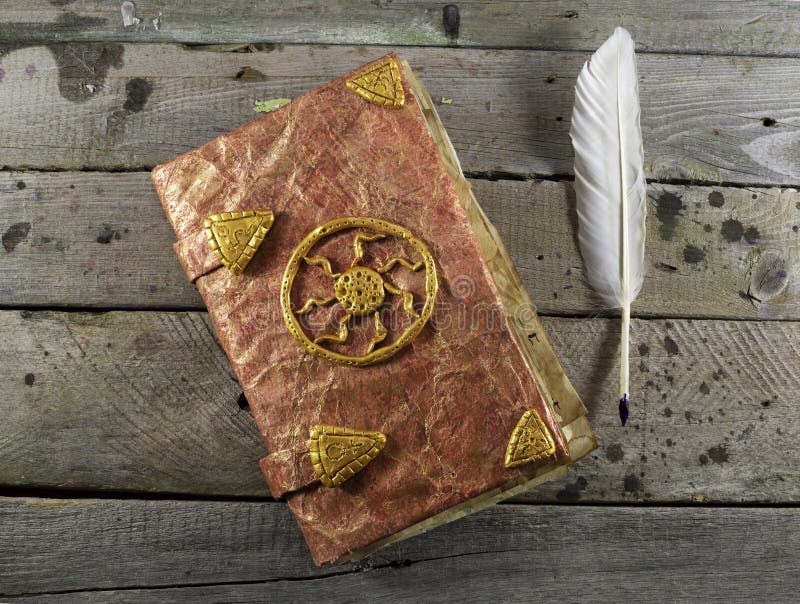 Magic book with feather stock image. Image of esoterica - 30111793