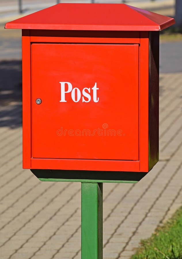 Red mail box on the street stock photo. Image of front - 61642954
