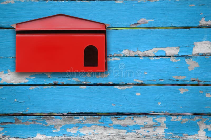 Red mailbox with blue wood stock image. Image of house - 78786695