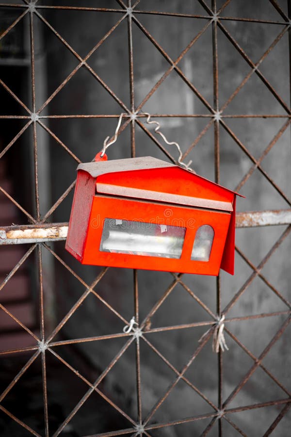 Red Mailbox on an Iron Lattice Gate. Logistics and Mail Stock Image ...