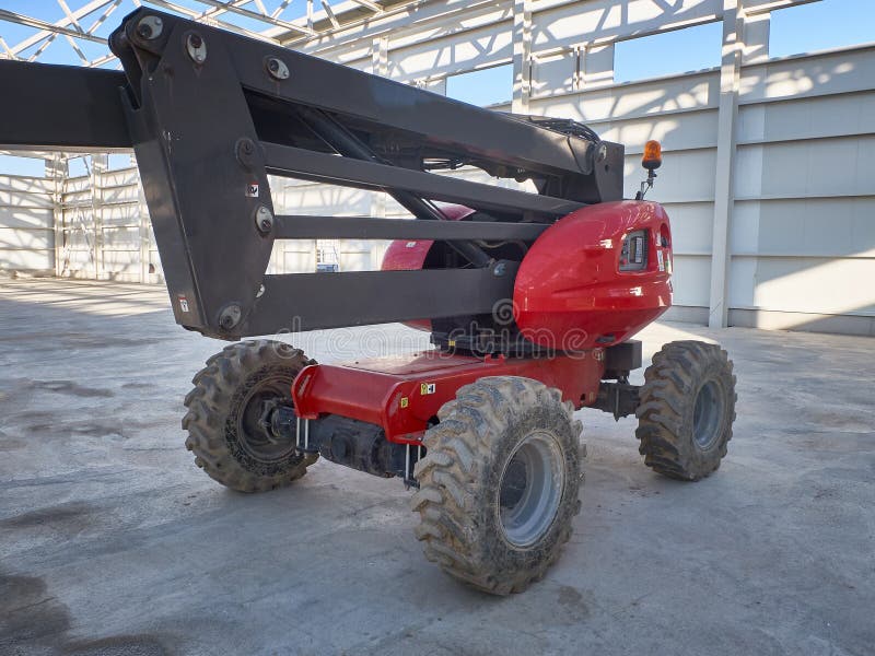 Red Man Lifting Platform Machinery at Construction Site Stock Image ...