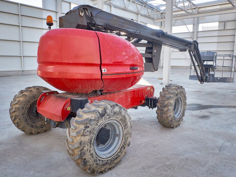 Red Man Lifting Platform Machinery at Construction Site Stock Photo ...