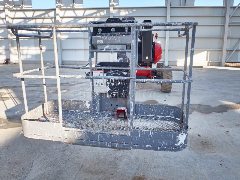 Red Man Lifting Platform Machinery at Construction Site Stock Photo ...