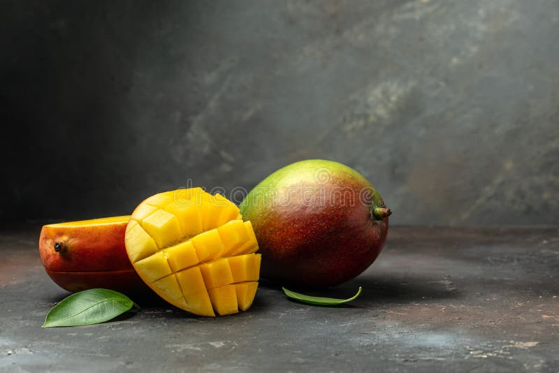 Red Mango. Fresh Tropical Fruit on a Dark Background Stock Image ...
