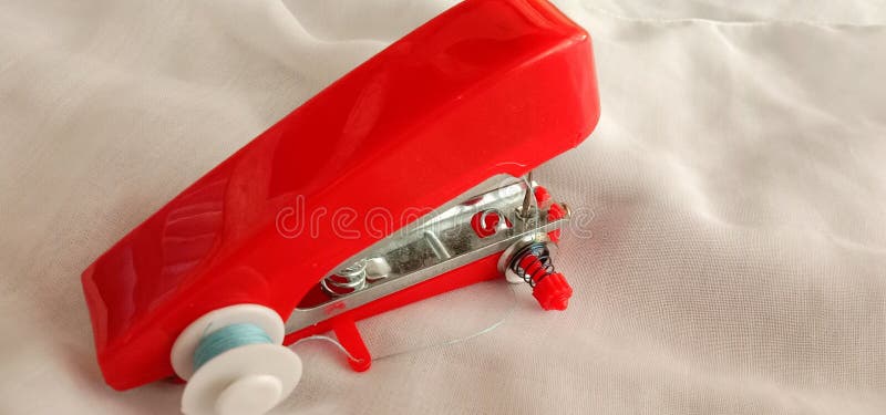 Red Manual Sewing Machine on White Cloth Stock Image - Image of bumper ...