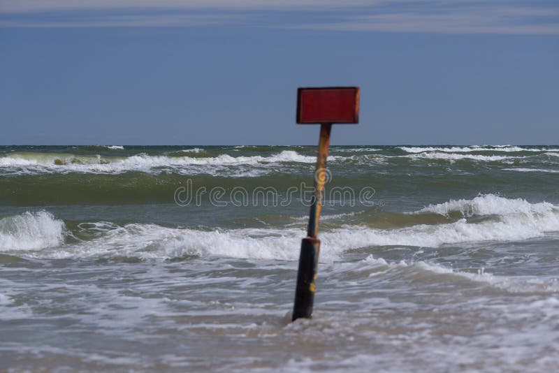 RED MARK and WEATHER by the SEA Stock Photo - Image of waves, caution ...
