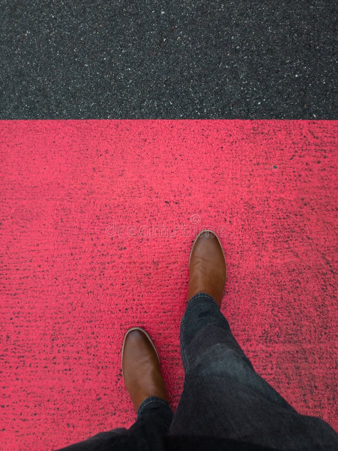 Red Marking on Pavement with Leather Boot Stock Photo - Image of ...