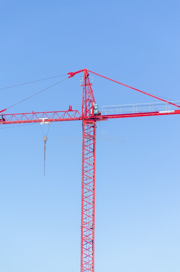 Red Metal Crane with Blue Sky in the Background Stock Photo - Image of ...