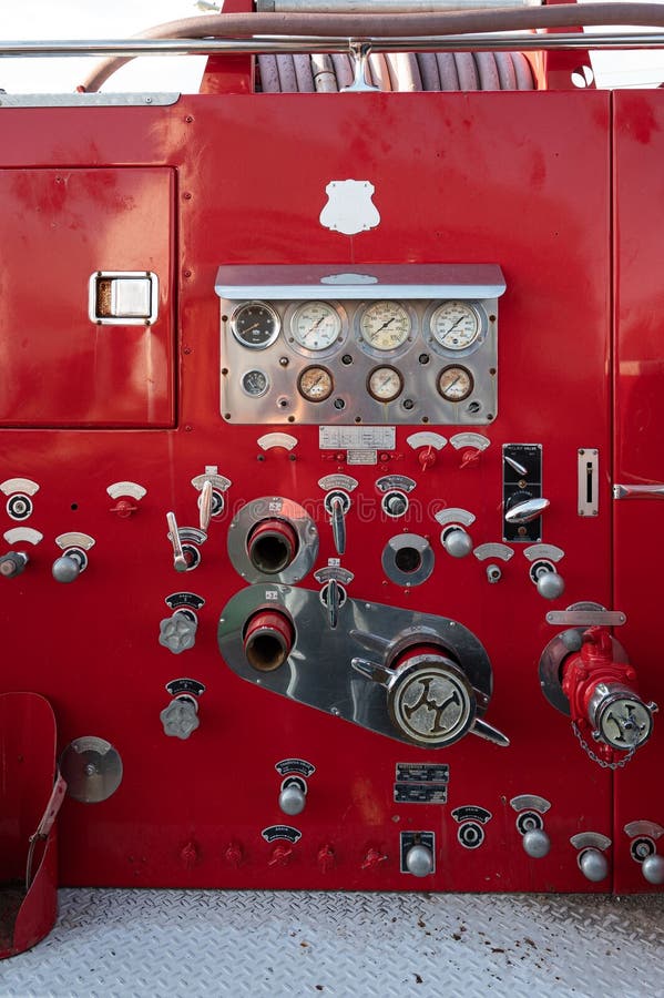 Red Metal Engine on Top of an Old Fire Truck Covered in Lots of Other ...