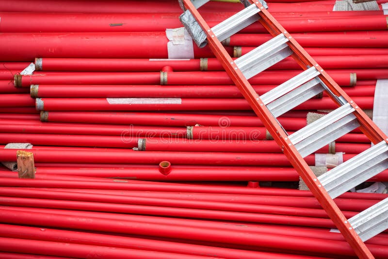 Red metal pipes stock photo. Image of engineering, iron - 75670416