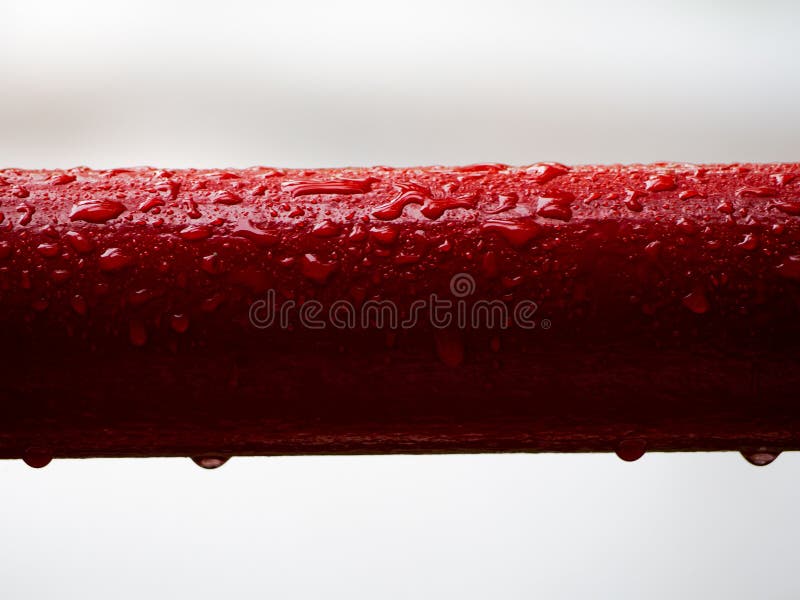 Red Metal Railing in the Rain - Droplets of Water Stock Image - Image ...