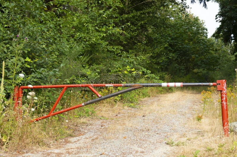 Red Metal Security Gate and Rural Road Stock Image - Image of barricade ...