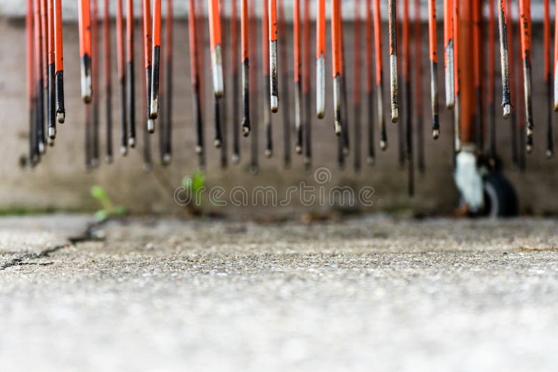 Red Metal Spike with Black Tip Abstract Close Up View with Concrete ...