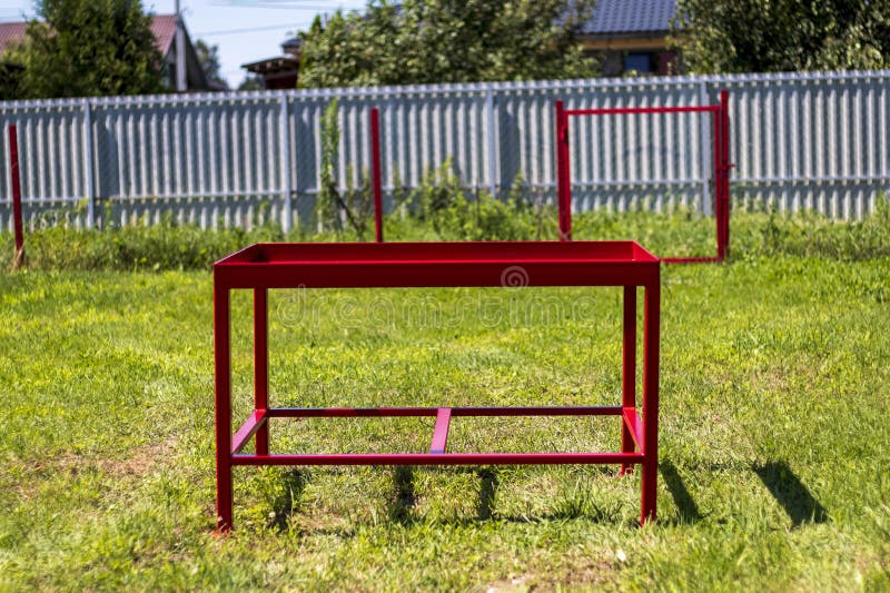 Red Metal Stand for Container, Water Tank. Shallow Depth of Field ...