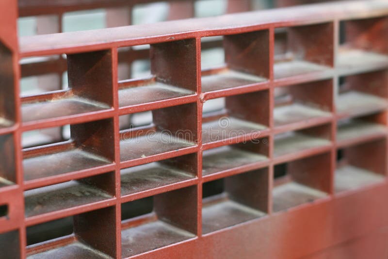 Red metallic grate wall stock photo. Image of detail - 70161382