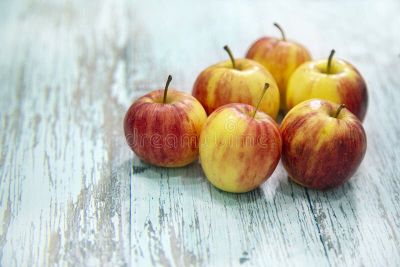 Red Mini Apple on Wood Green Wood Table Stock Image - Image of ...