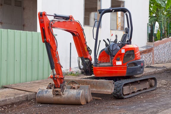 Red mini excavator stock image. Image of side, excavation - 269567675