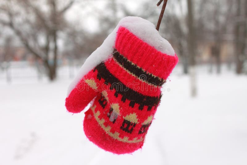 Red Mitten in the Snow in Winter Stock Image - Image of outdoors ...