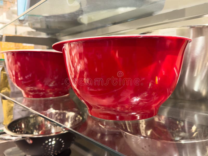 Red Mixing Bowls on Glass Shelf in Kitchenware Store Display Editorial ...