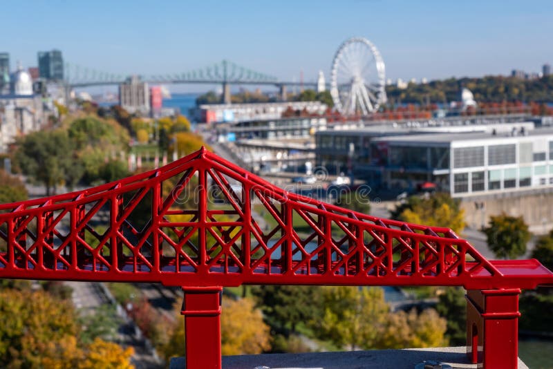 Red Model of Jacques Cartier Bridge in Front of Panoramic View of ...