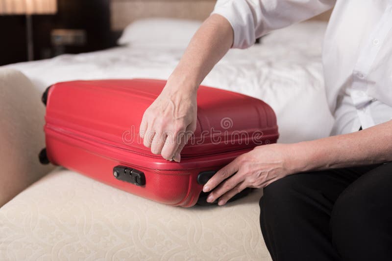 Red Modern Valise Lying on the Sofa Stock Photo - Image of modern ...