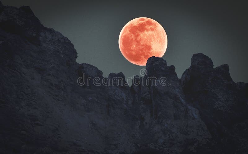 Red moon and black rocks stock image. Image of moon - 232068533