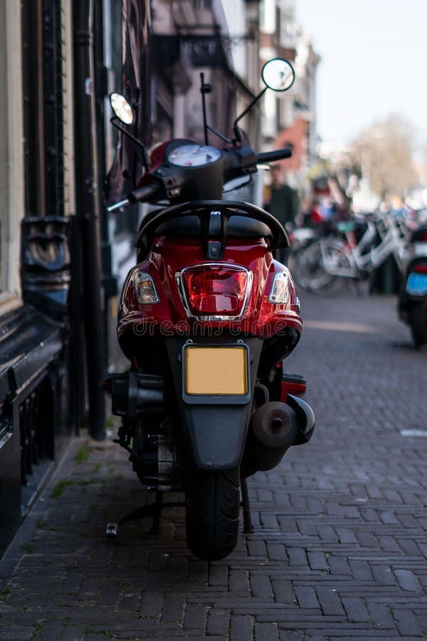 Red moped beside a street stock image. Image of vespa - 277319151