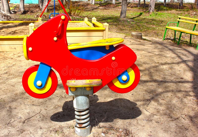 Red Motorcycle, Children`s Playground in the Spring Stock Photo - Image ...