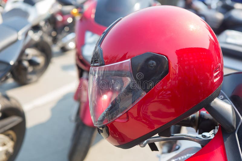 Red Motorcycle Helmet on a Motorcycle Stock Image - Image of clothing ...