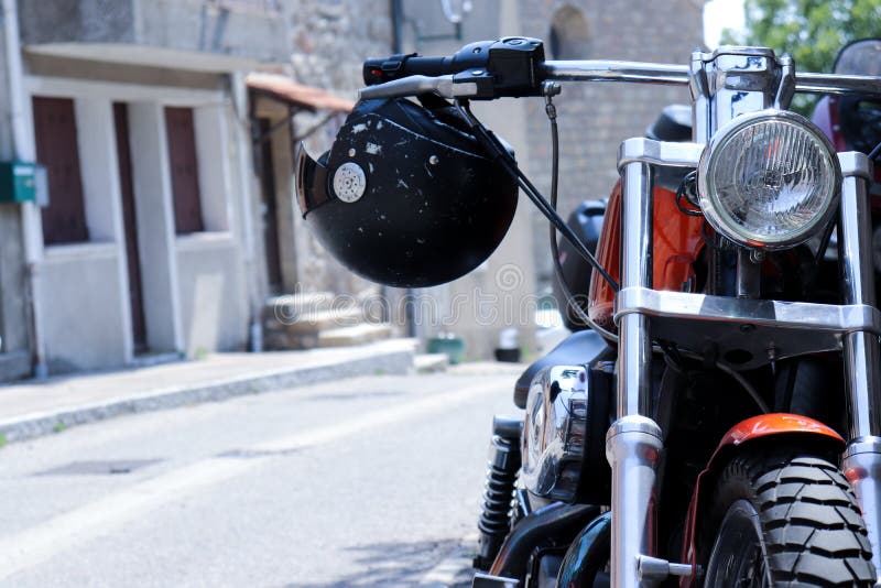 Red Motorcycle with a Helmet Hanging Off the Handlebars Shot from the ...