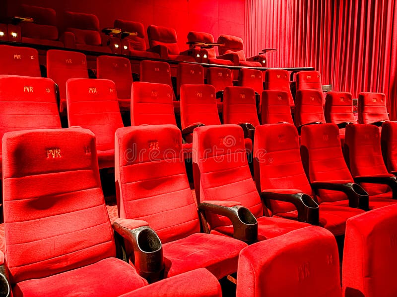 A Red Movie Theater with Rows of Red Chairs Stock Photo - Image of ...