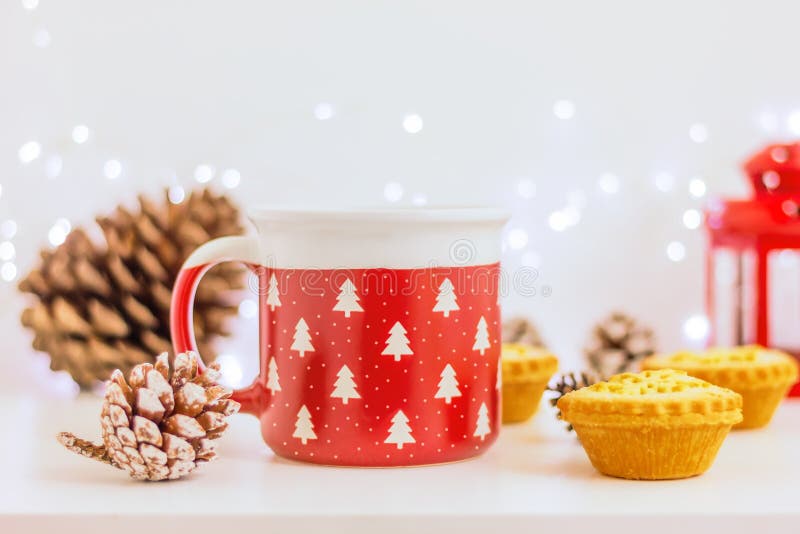 Red Mug with Christmas Trees and Mini Cakes with Snowflake and Pine ...