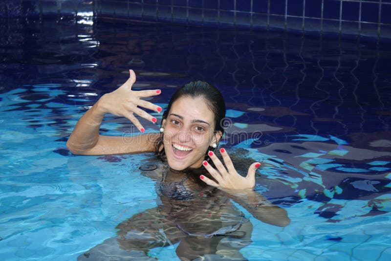 Girl getting out of pool stock image. Image of face, water - 13337043