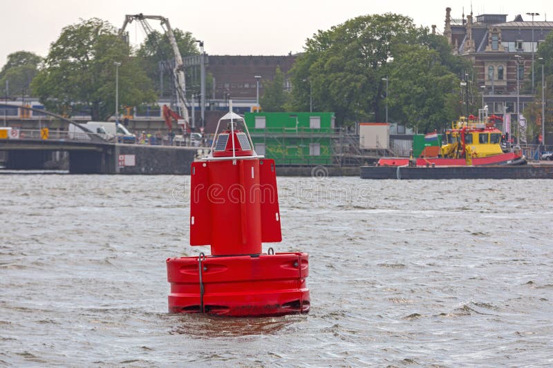 Red Navigation Buoy or Aid for Transportation Showing Flow in the Water ...