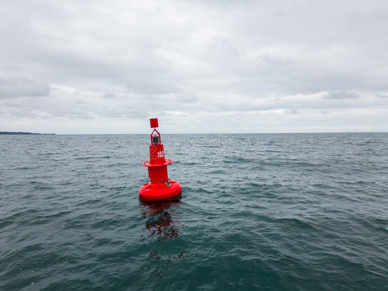 Red Navigational Buoy in Sea with Clouds Slow Motion Stock Image ...