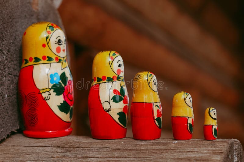 Red Nesting Dolls Stand on a Wooden House Stock Image - Image of ...