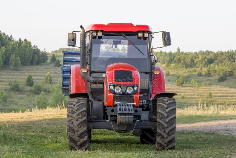 Red New Wheeled Tractor of Medium Size. Stock Image - Image of vehicle ...