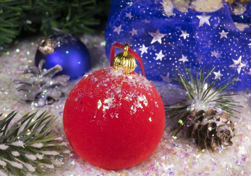Red New Year`s Ball on Decorative Snow and a Bag with Gift Stock Image ...